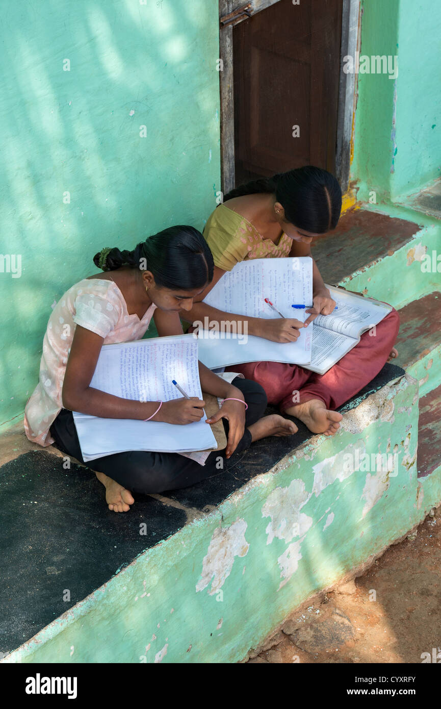 Teenage Indian village girls writing English in school book. Andhra ...