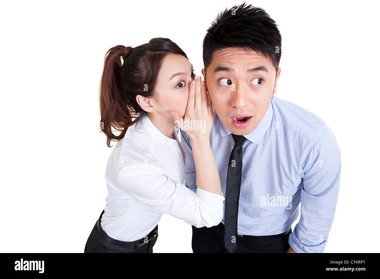 Office workers whispering Stock Photo - Alamy