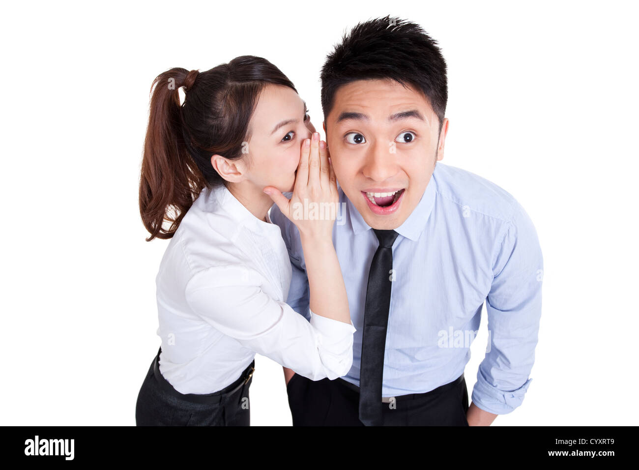 Office workers whispering Stock Photo - Alamy