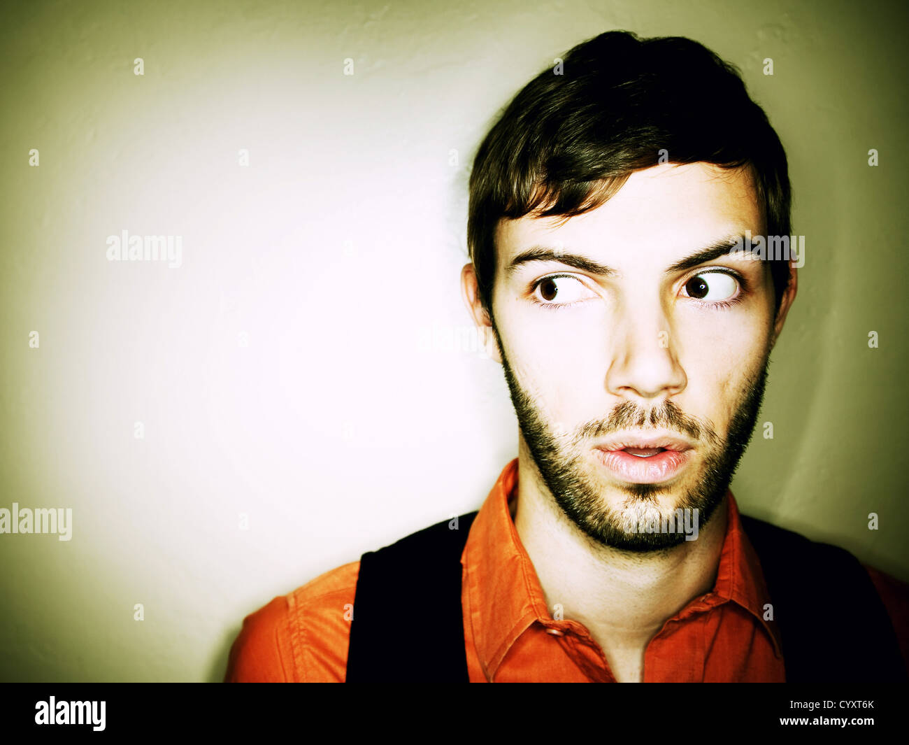 Apprehensive Young Man Looking to his Left Stock Photo - Alamy