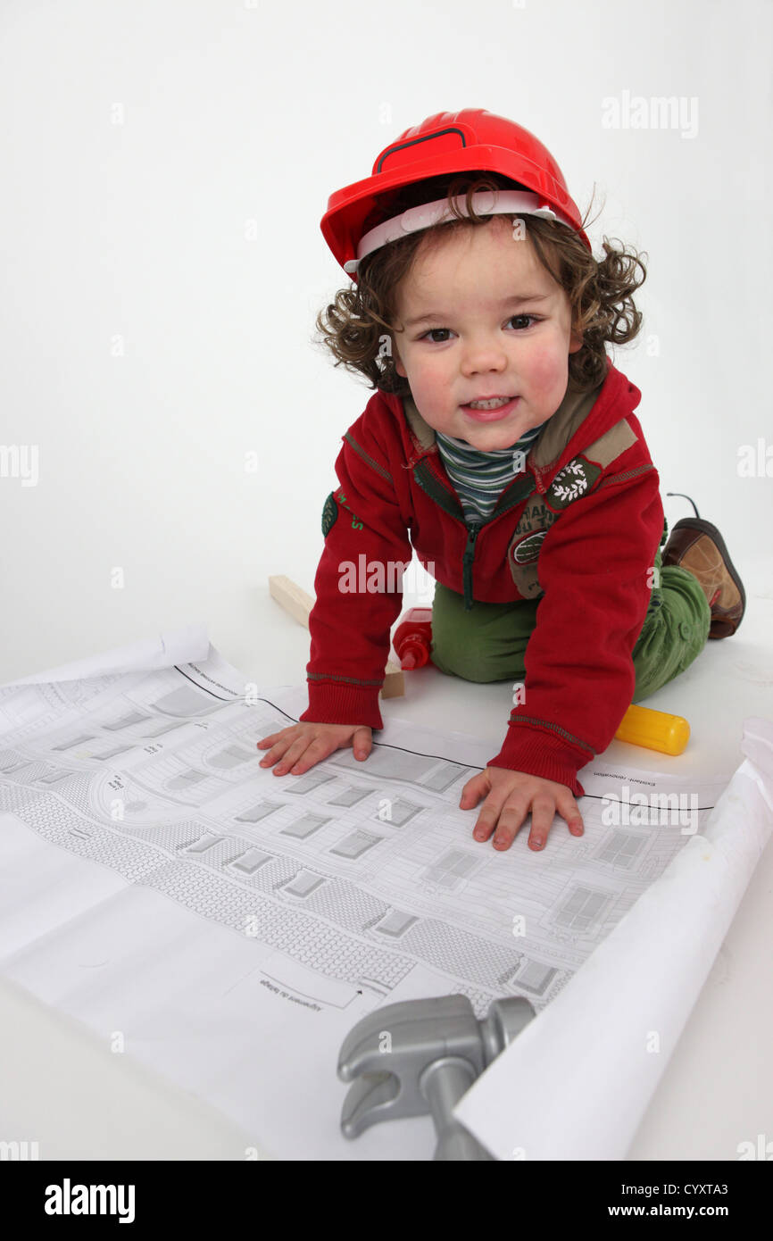 Young child pretending to be a construction worker Stock Photo - Alamy