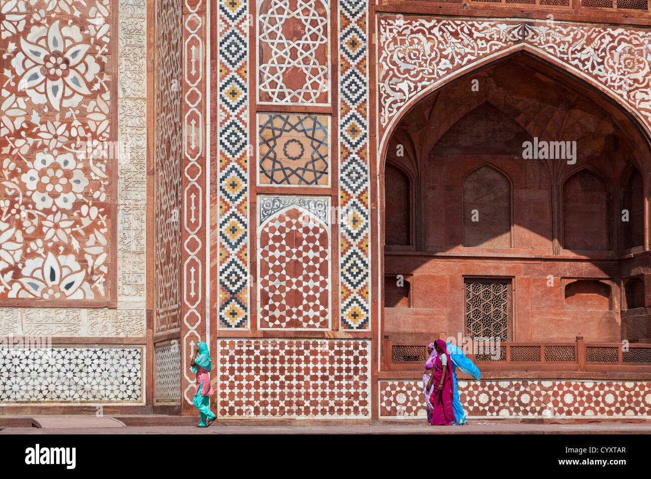 India, Uttar Pradesh, Agra, Women walking at Tomb of Akbar the Great ...