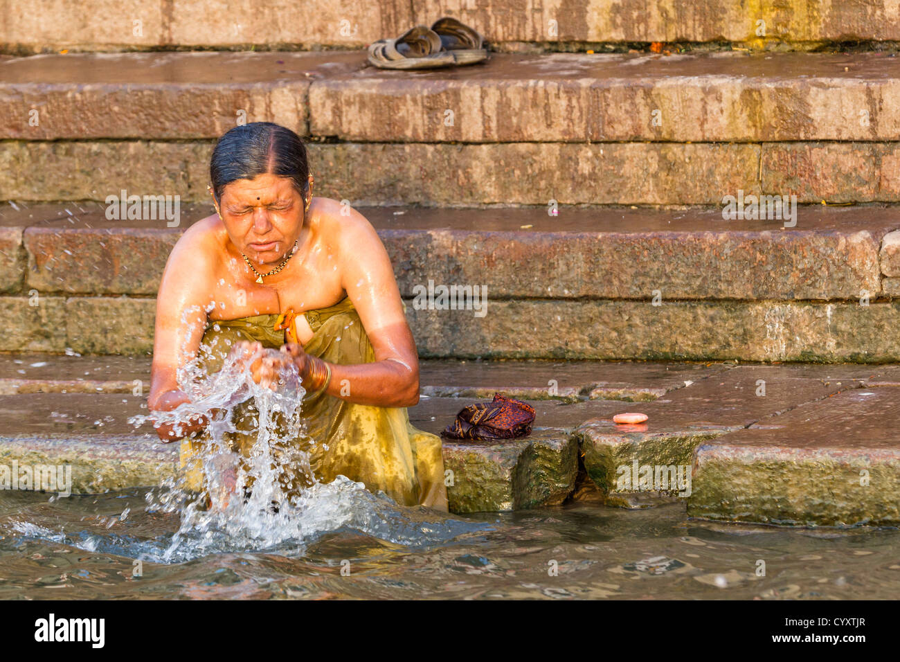Indian woman bathing in river hi-res stock photography and images - Alamy