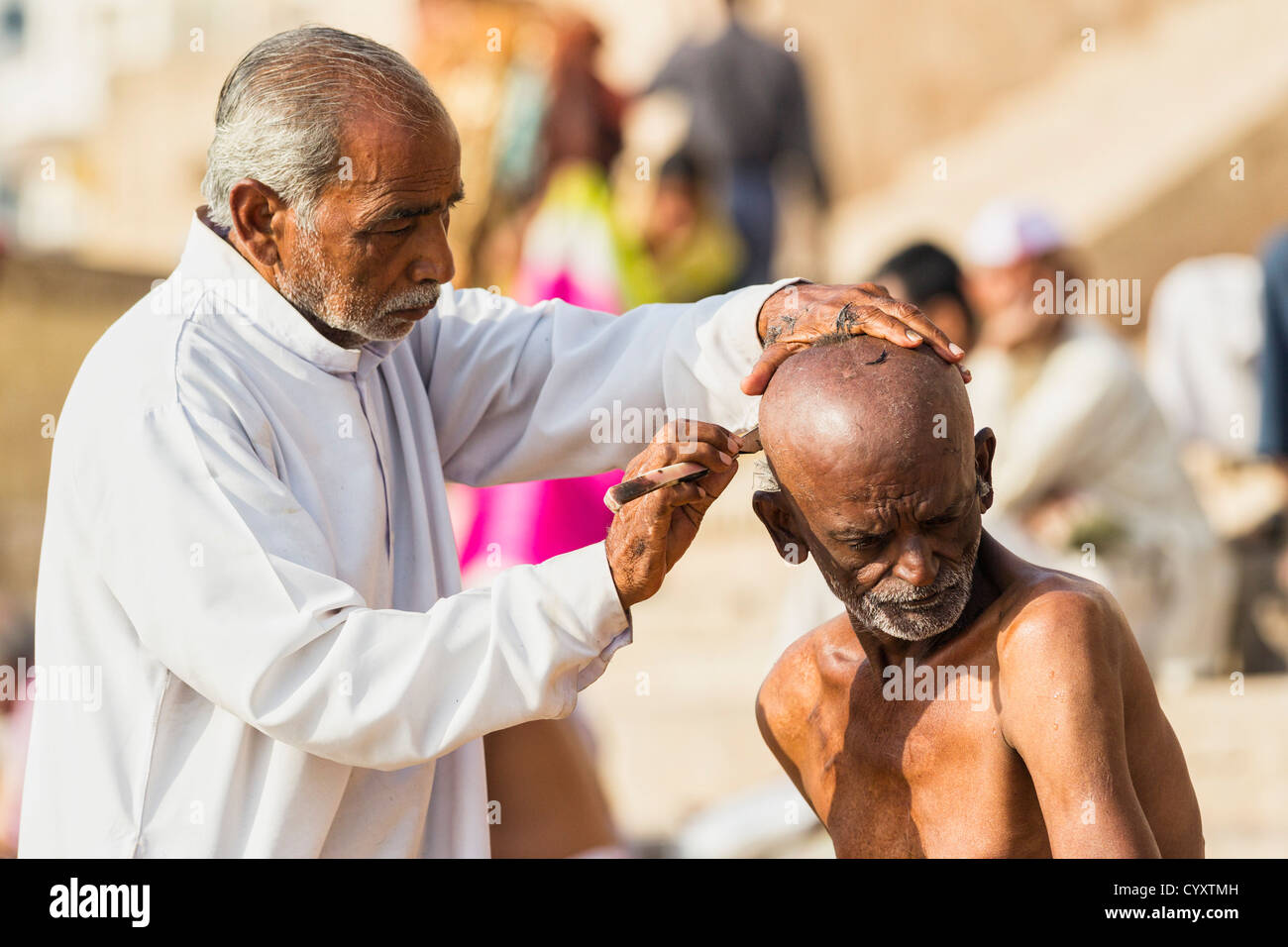 India Uttar Pradesh Banaras Barber Shaves Head Of Seniorman At River