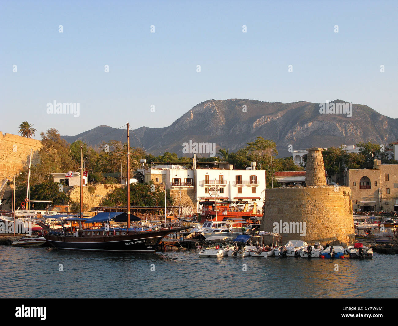 KYRENIA (GIRNE), NORTH CYPRUS. An evening view of the harbour, with the ...