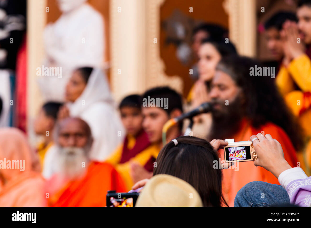 India, Uttarakhand, Rishikesh, Woman photographing Swami Chidanand ...