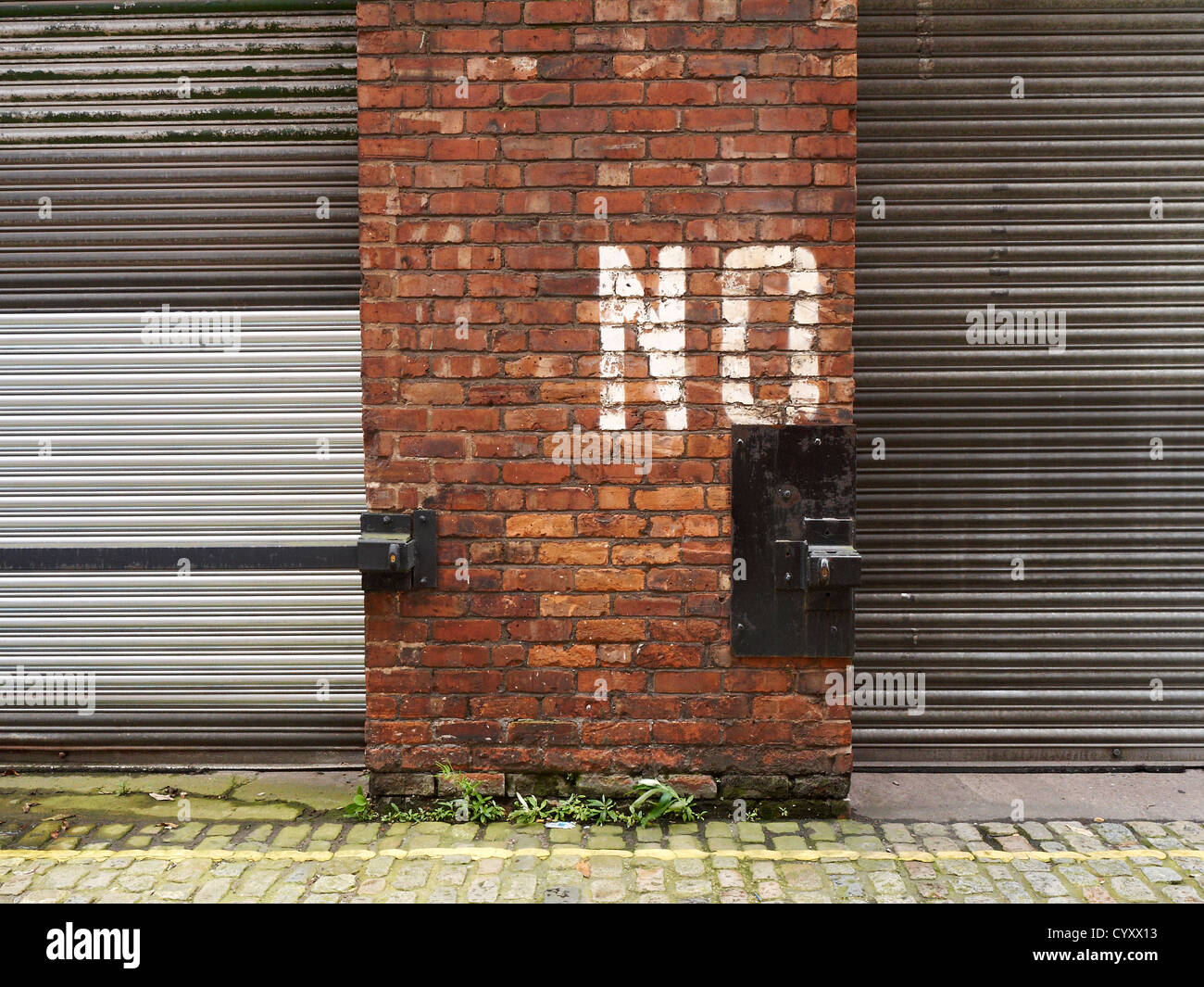 Writing on external brick wall Stock Photo - Alamy