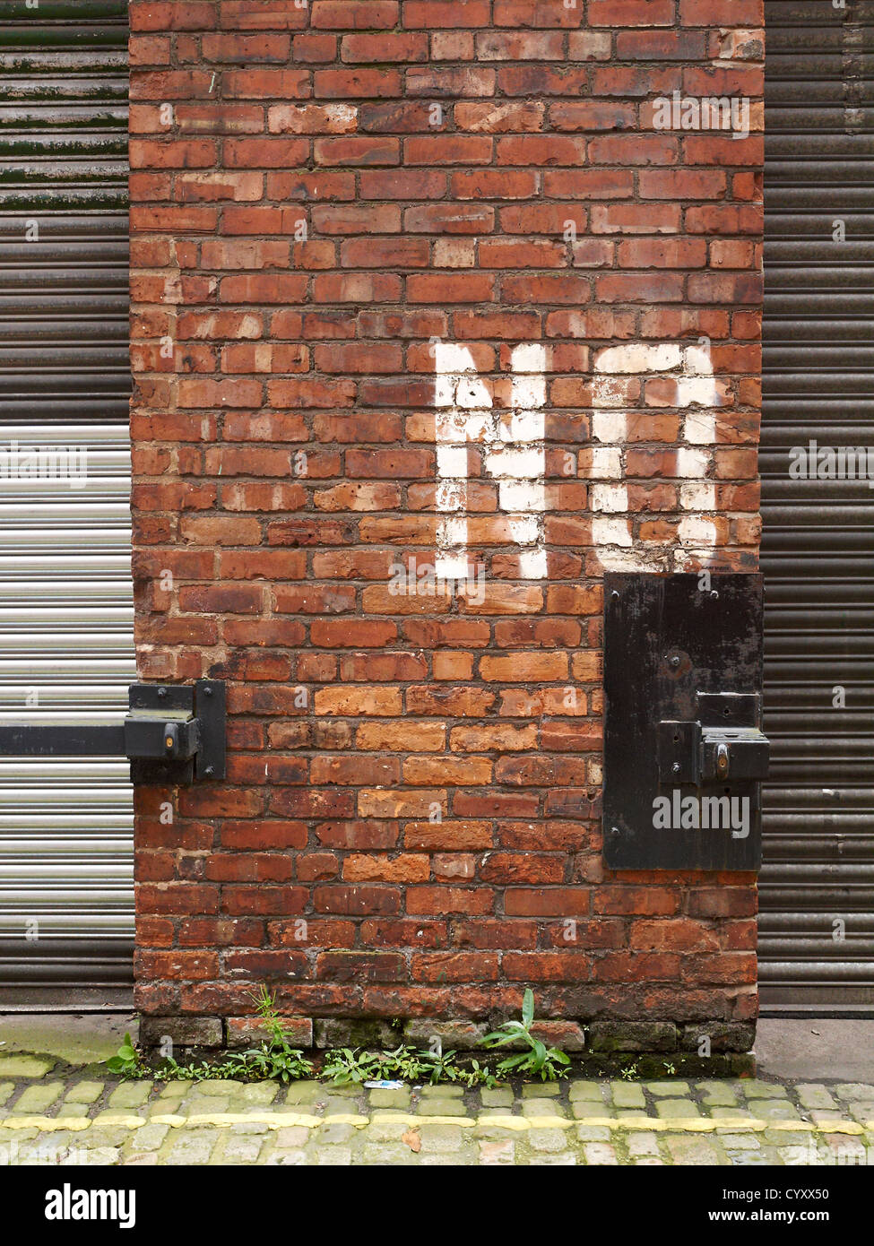 Writing on external brick wall Stock Photo - Alamy