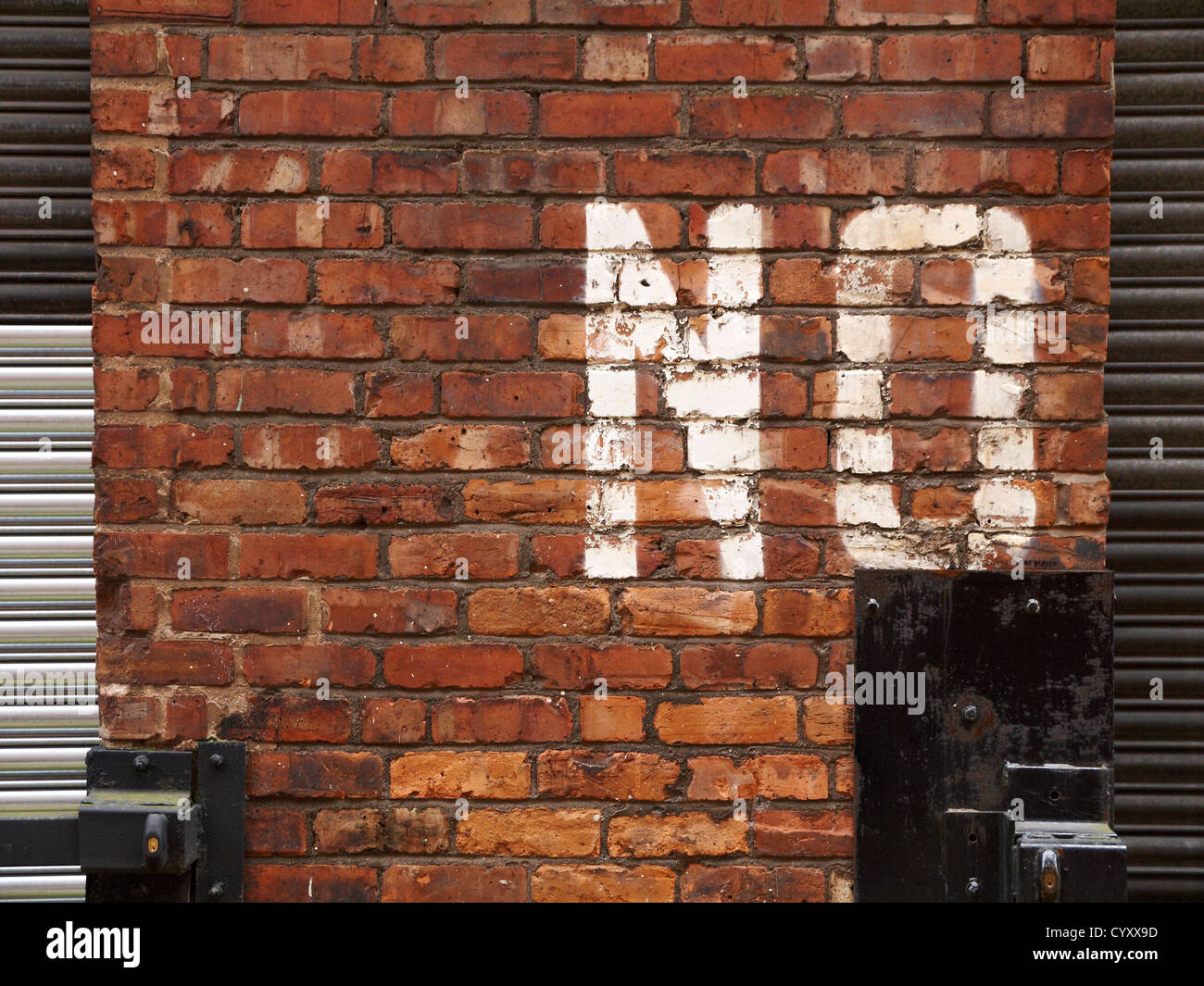 Writing on external brick wall Stock Photo - Alamy