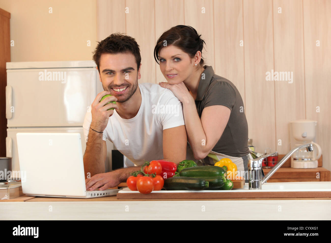 Couple in the kitchen Stock Photo - Alamy