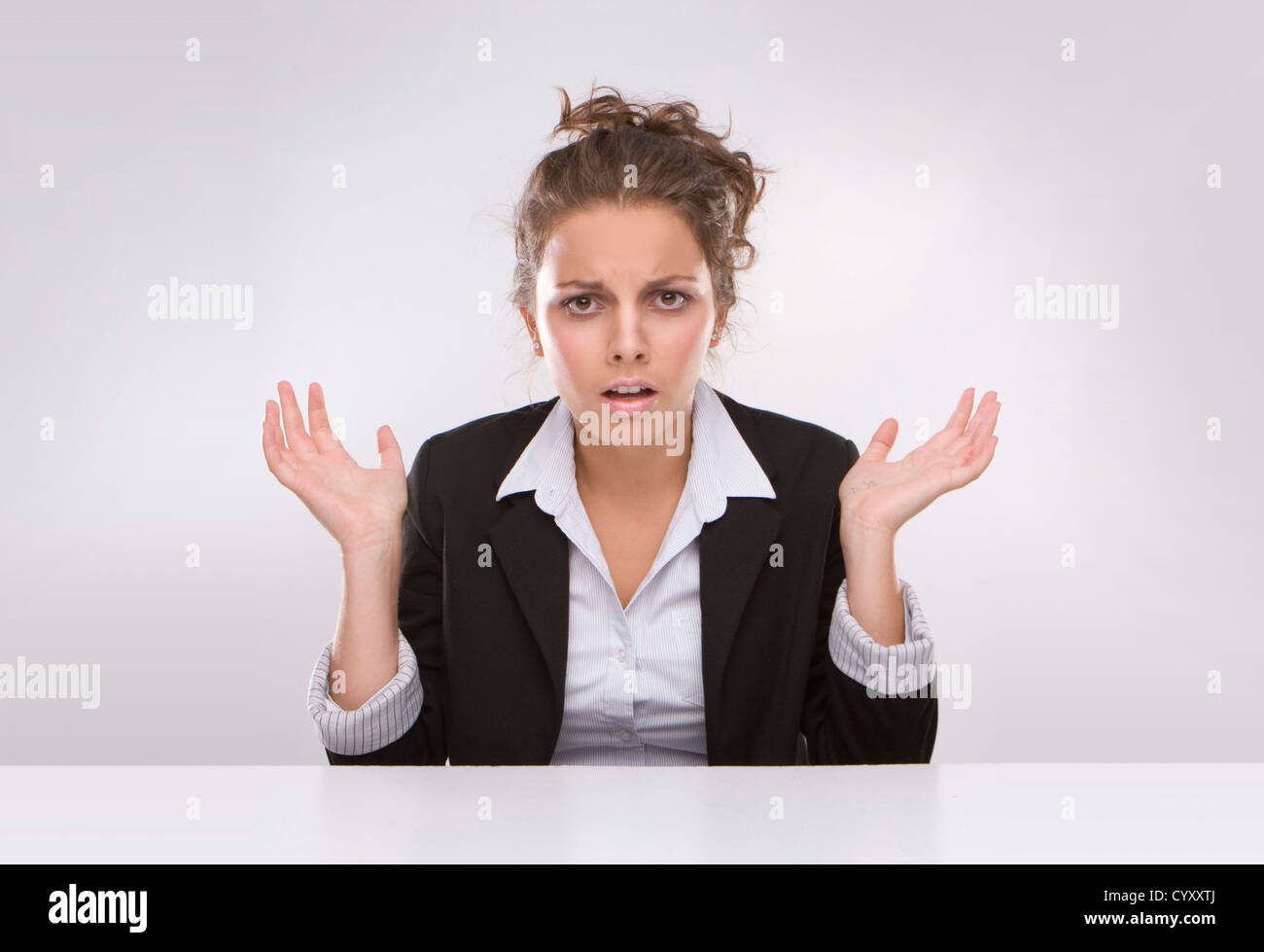 Confused businesswoman at work Stock Photo - Alamy