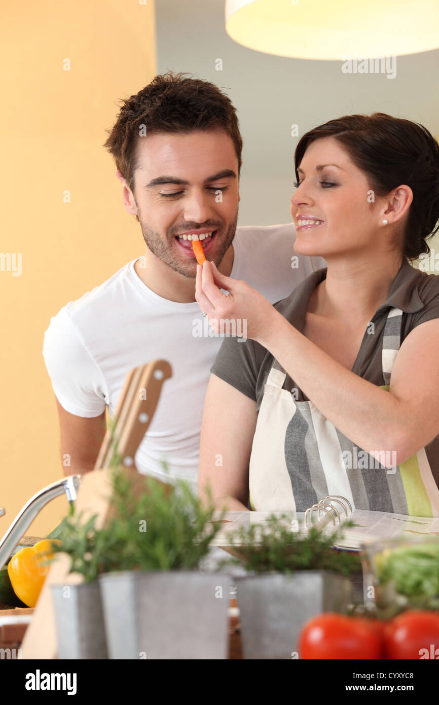 Couple in the kitchen Stock Photo - Alamy