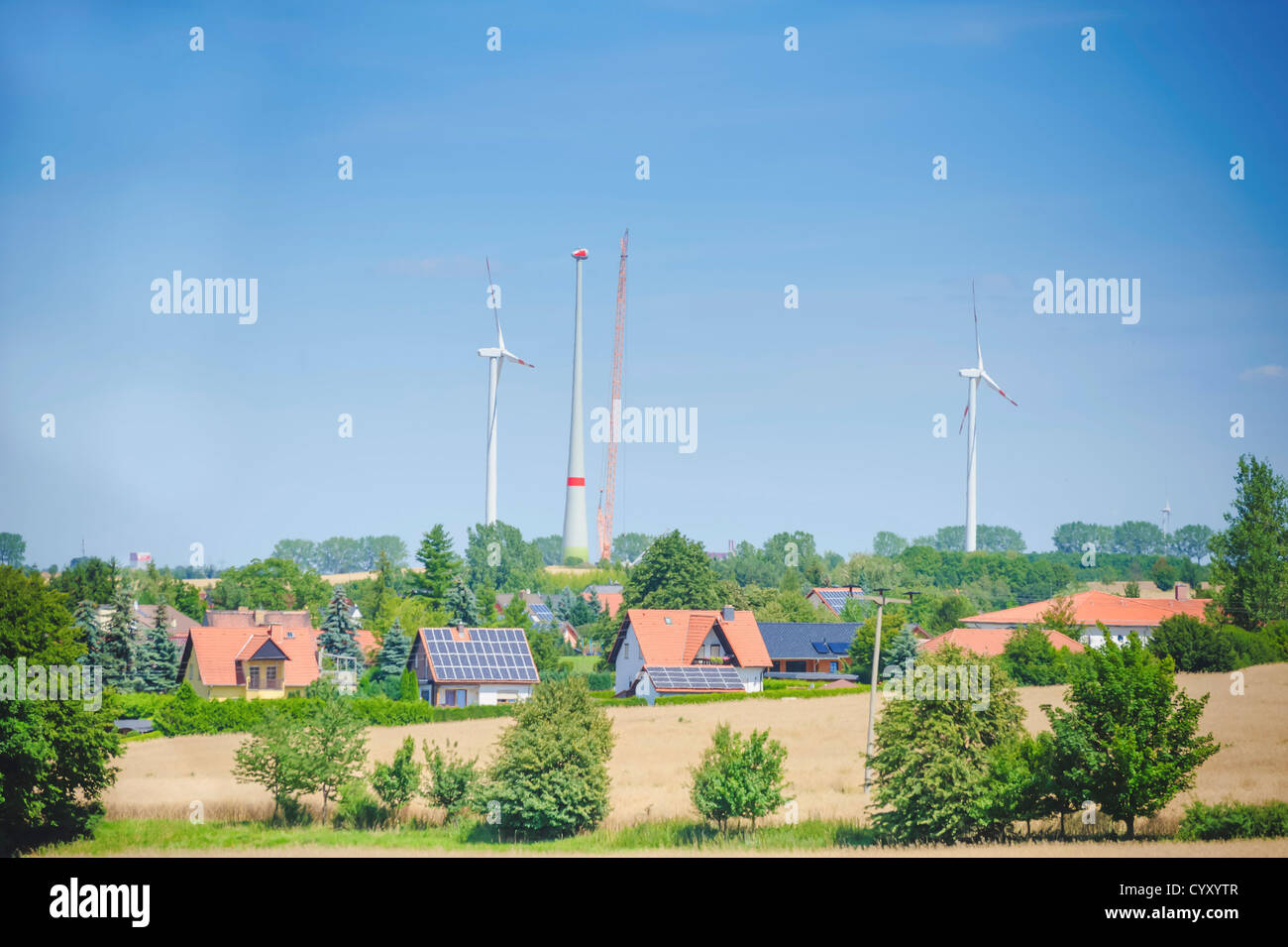 Germany, Saxony, View of wind turbine with solar panel in wind park ...