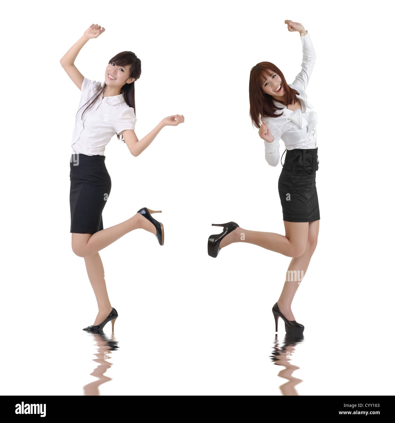 Happy business women dancing over white background Stock Photo - Alamy