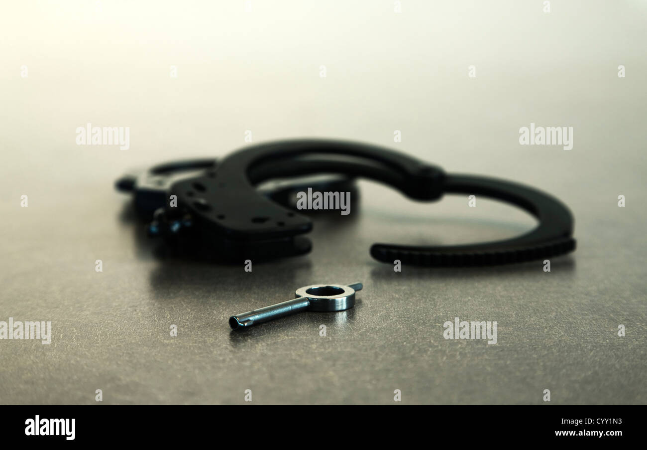 Open handcuffs hi-res stock photography and images - Alamy