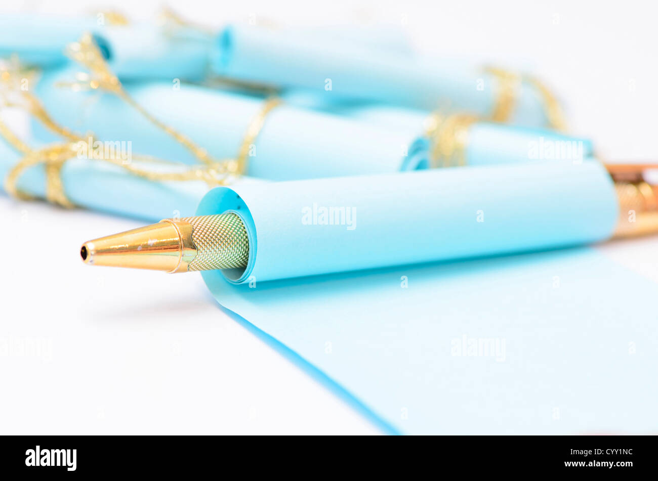 a pen and paper roll isolated on white Stock Photo - Alamy