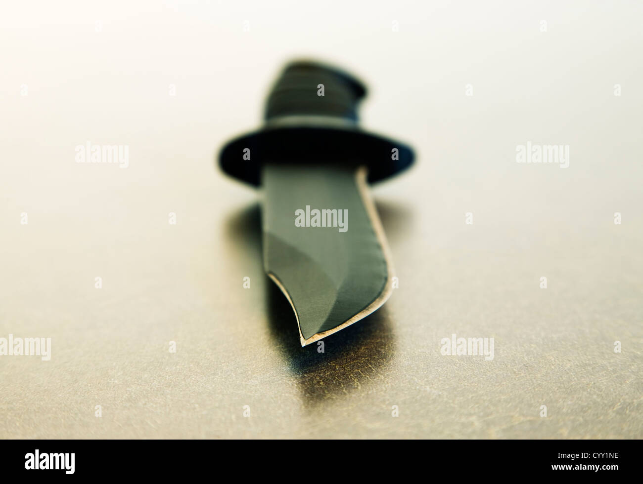 Tip of sharp knife blade on tabletop Stock Photo - Alamy