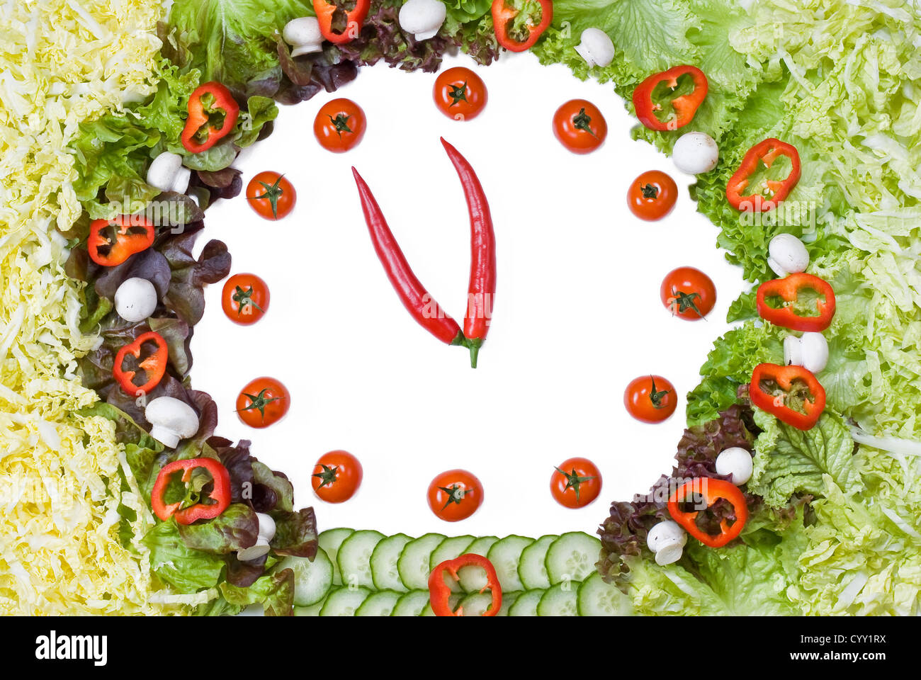 Vegetable clock created on white background from fresh vegetables Stock ...