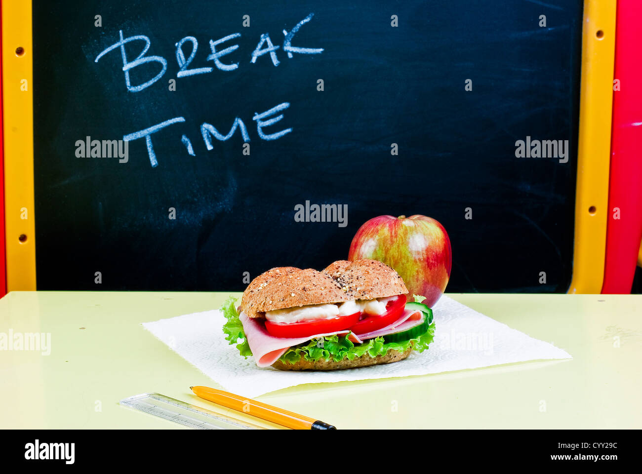 Sandwich and apple on classroom table - breakfast Stock Photo - Alamy
