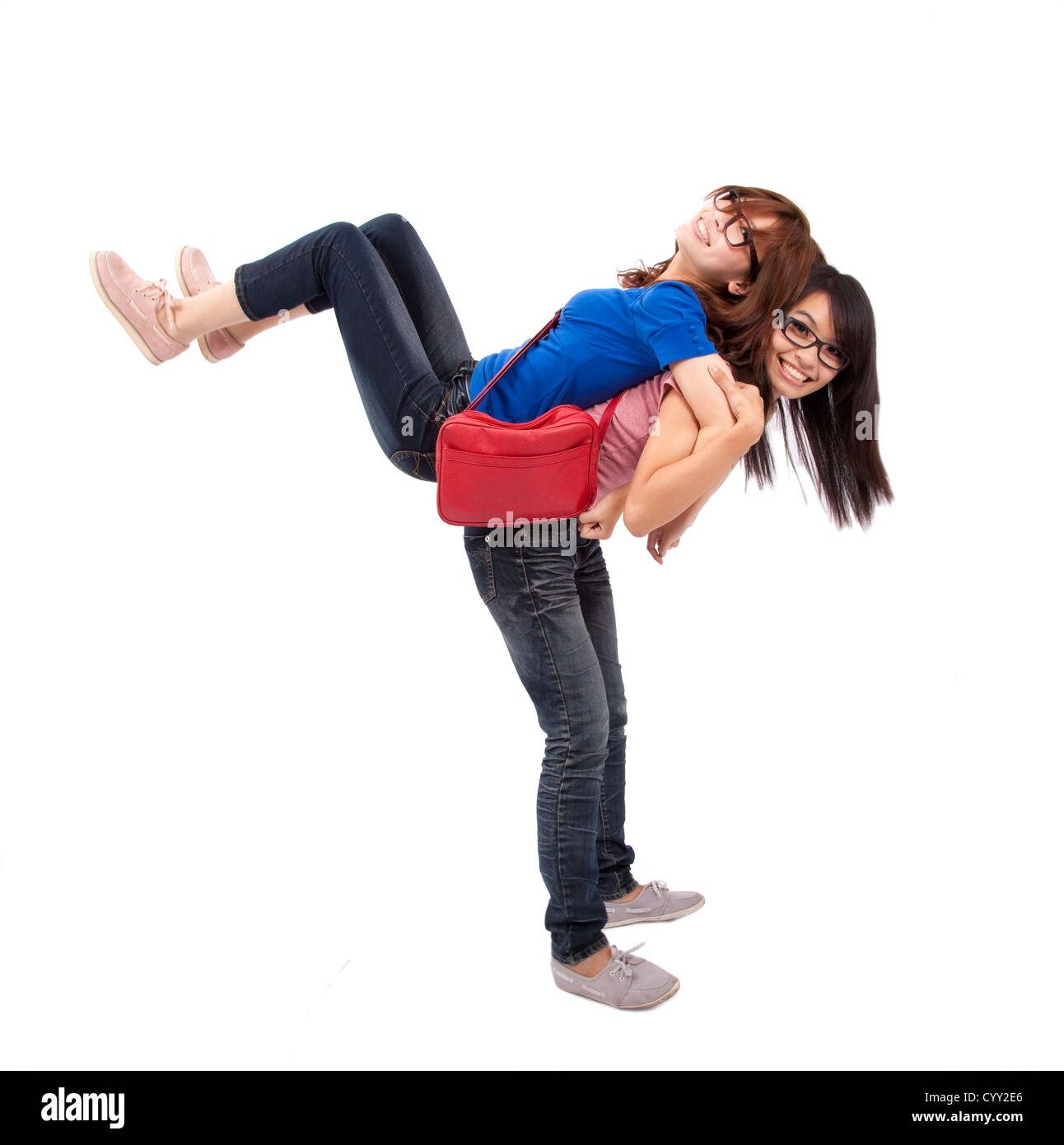 Two teenage girls playing together Stock Photo - Alamy