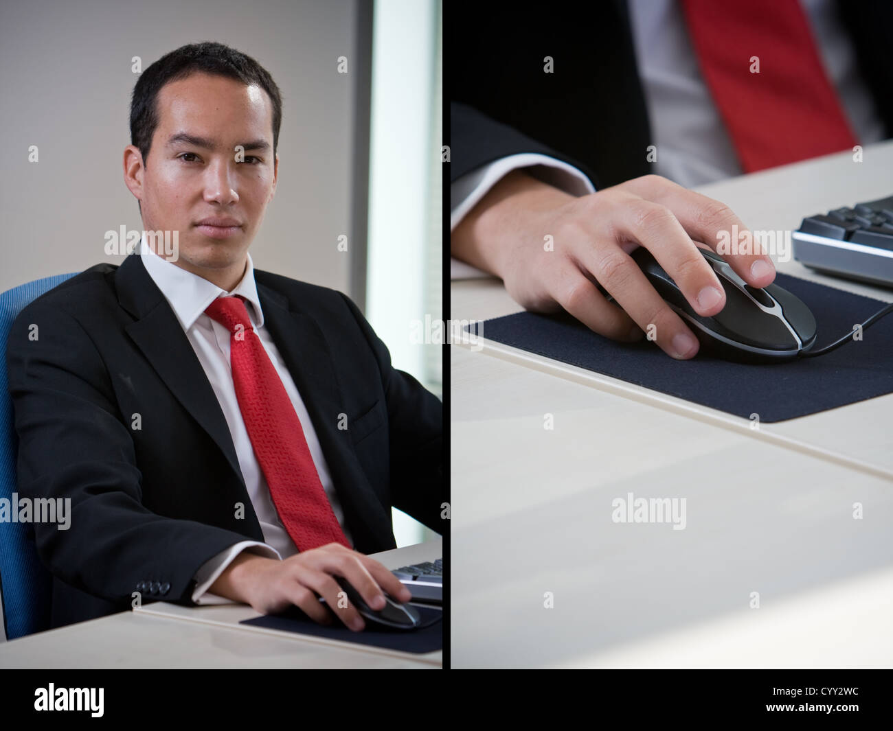 Handsome asian chinese business man using computer holding the mouse ...