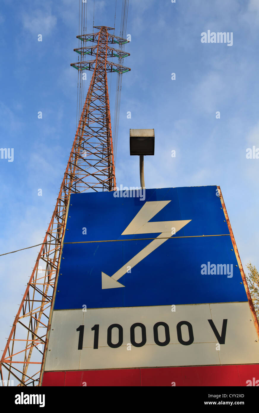 High voltage AC transmission tower with a warning sign Stock Photo - Alamy