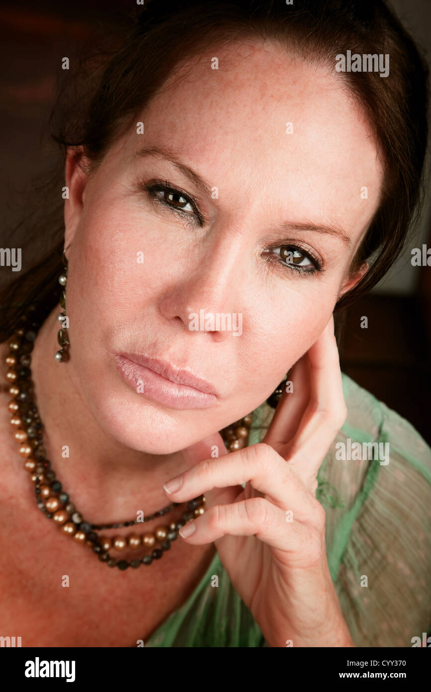 Pretty woman with confused expression on her face Stock Photo - Alamy
