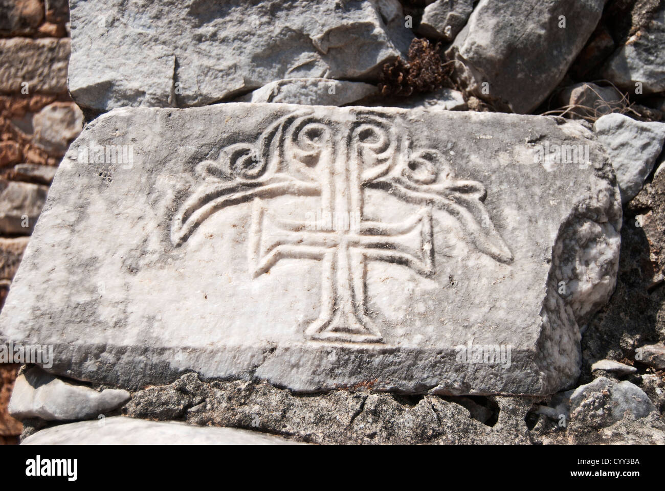 limestone block decorated with a carved cross Stock Photo - Alamy