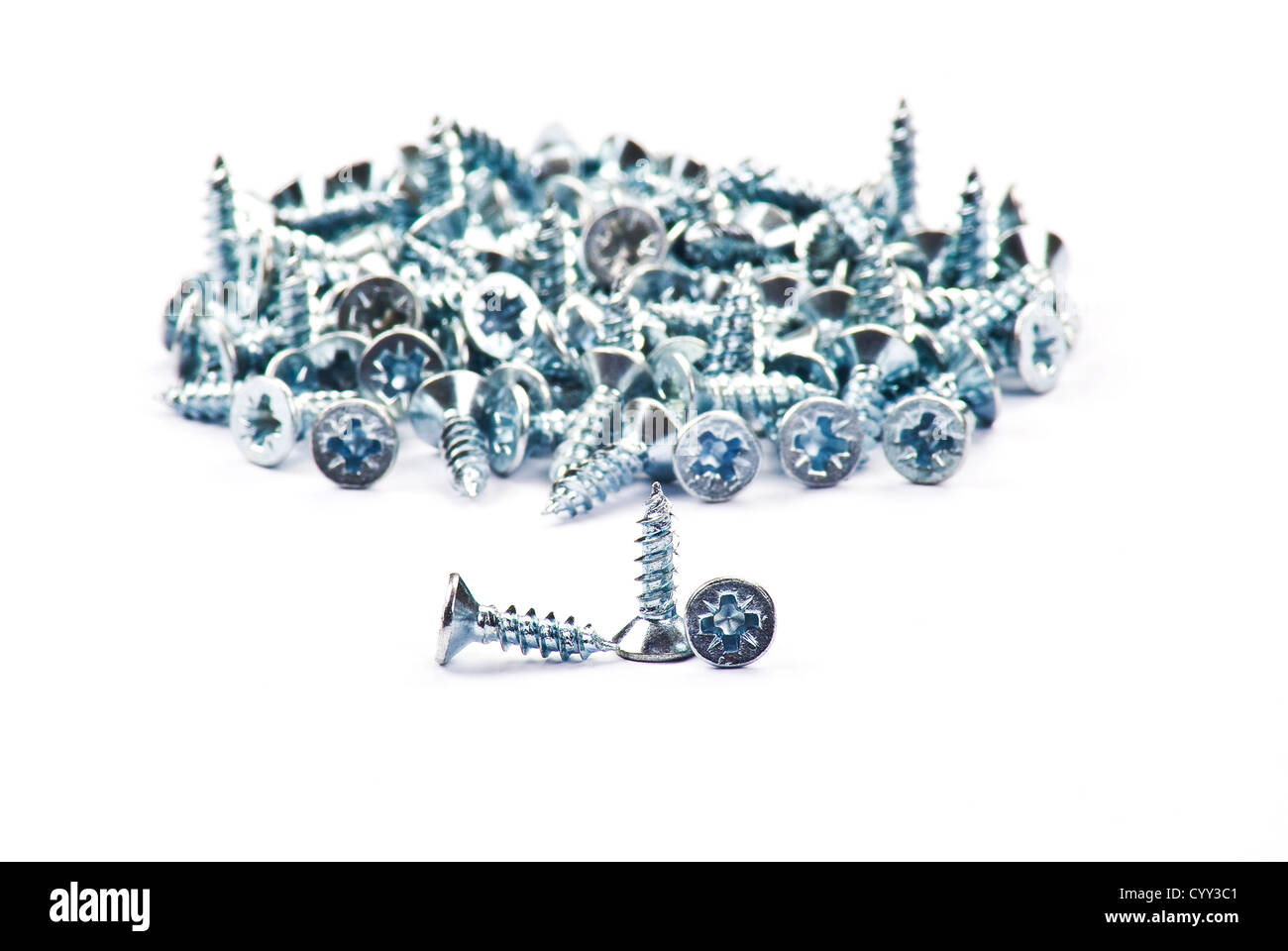 Close up of metal screws over white background Stock Photo - Alamy