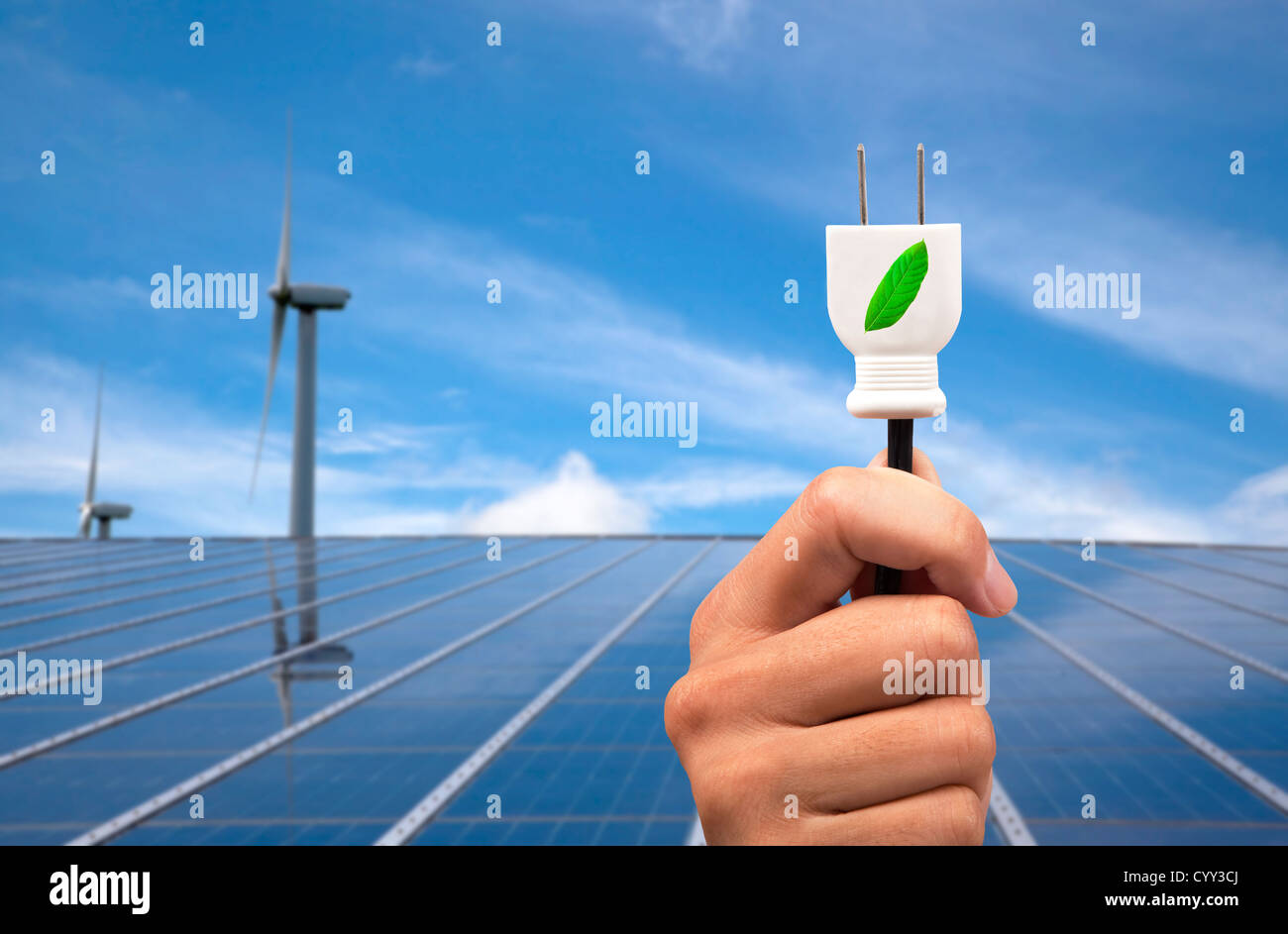 ECO power concept.hand holding green power plug and solar panel and ...