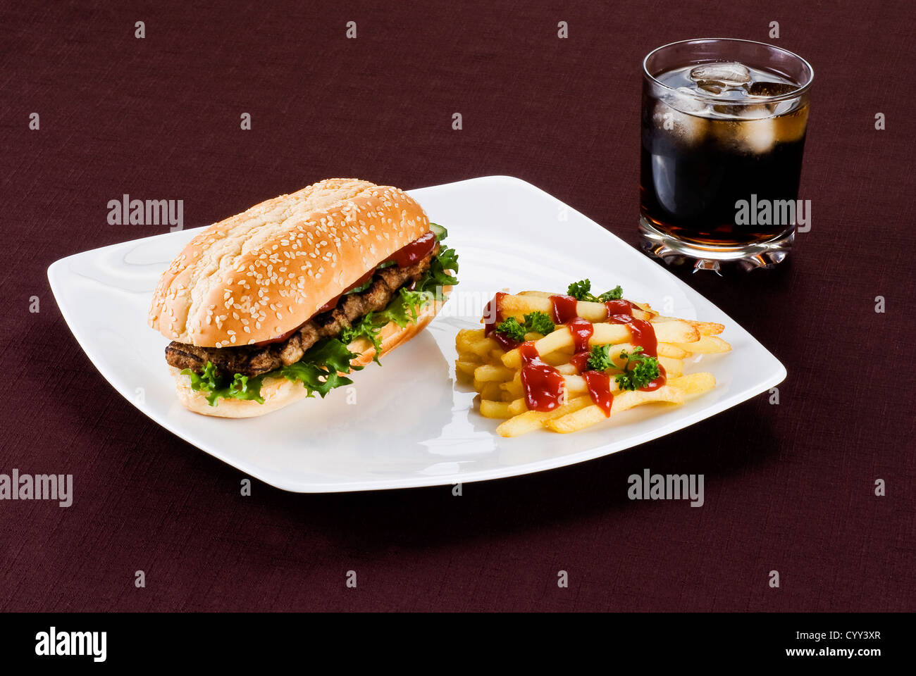Ribeye steak in sesame seed bun with fries and coke Stock Photo - Alamy