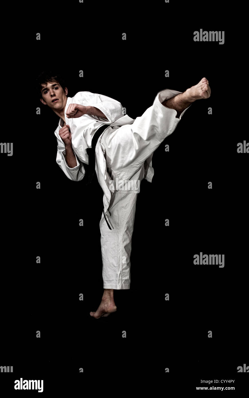 Karate male fighter young high contrast on black background Stock Photo ...