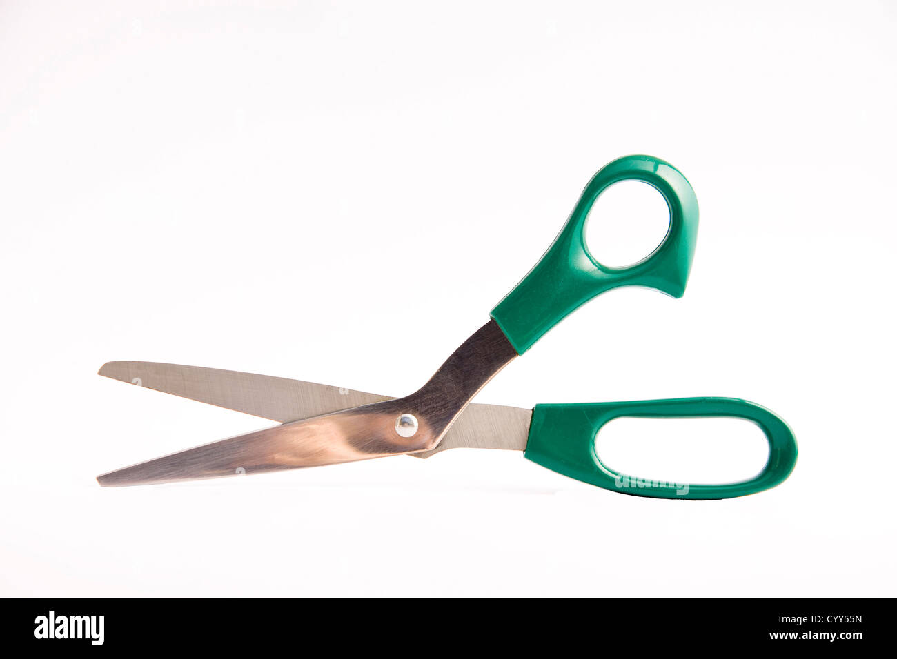 Scissors with green handles Stock Photo - Alamy