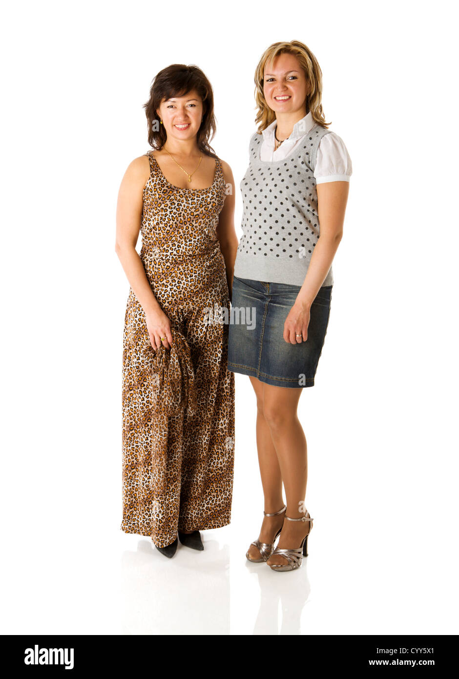 Two happy women standing together isolated on white Stock Photo - Alamy