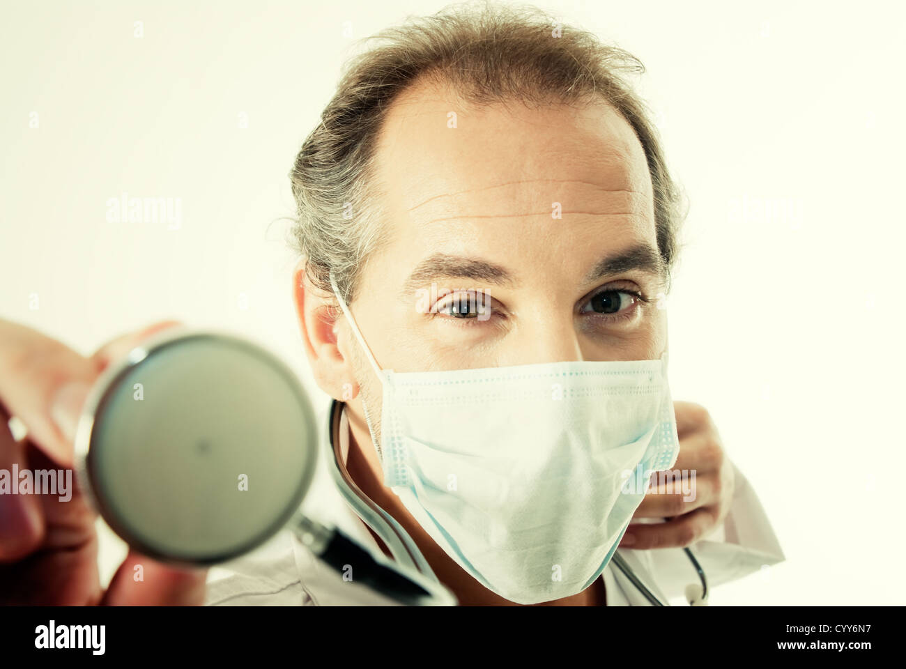 Doctor with stethoscope and flu mask Stock Photo - Alamy