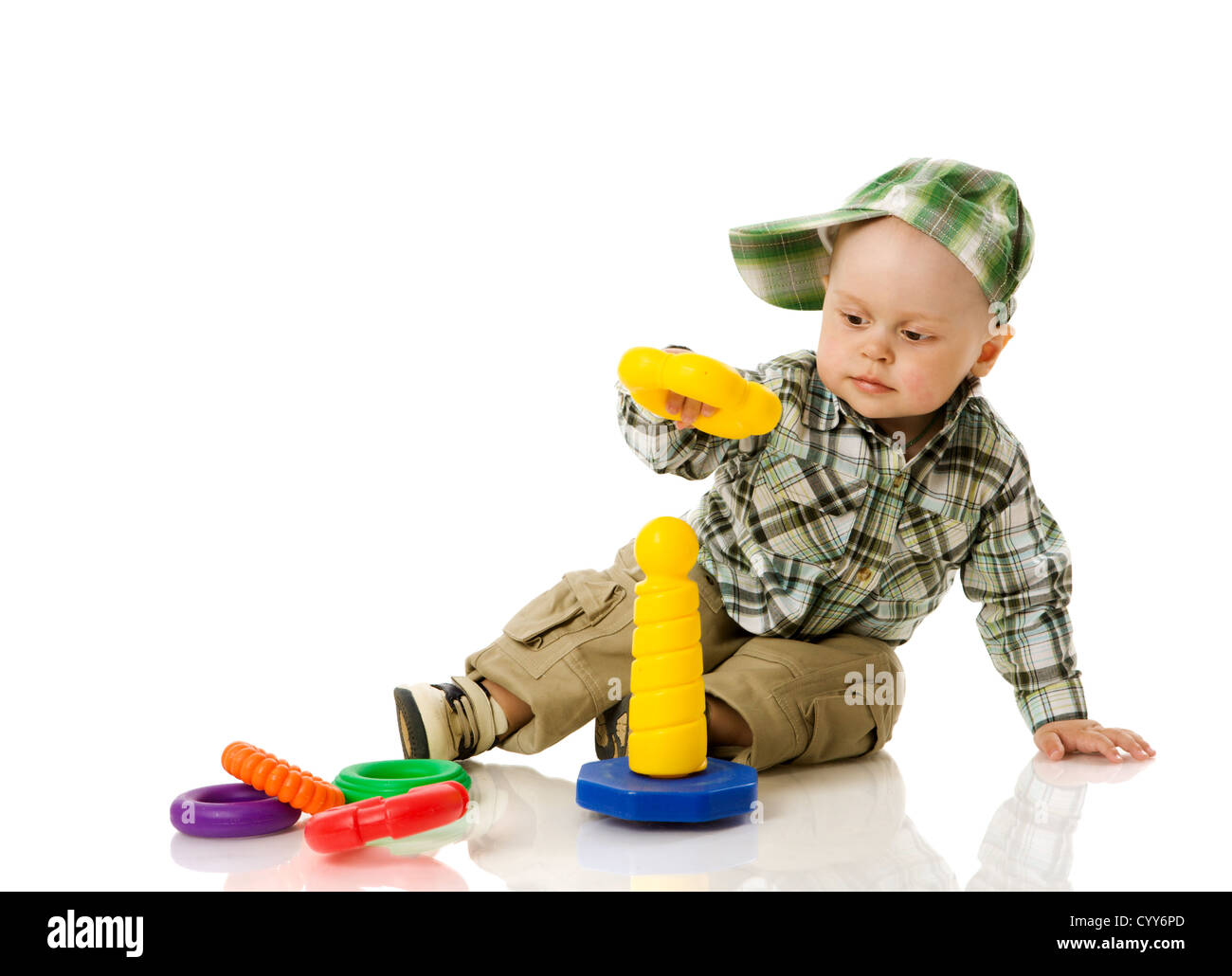 boy collecting colorful pyramid toy isolated on white Stock Photo - Alamy