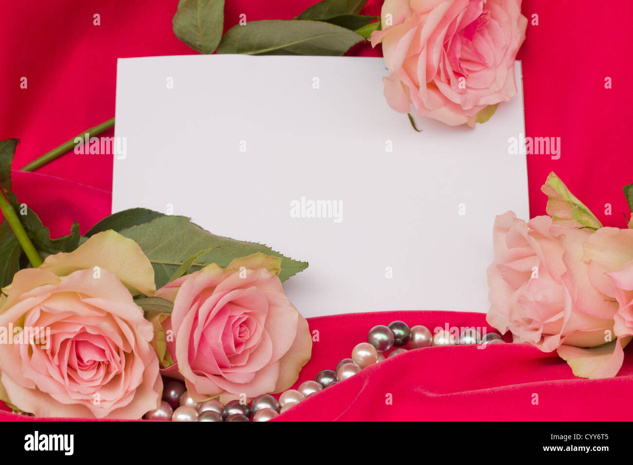 pink roses with pearls strand and blank card background Stock Photo - Alamy