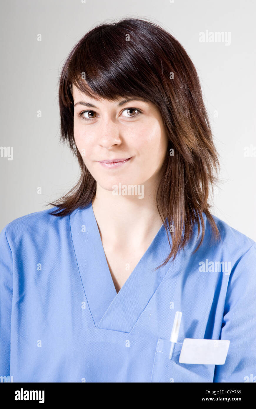 Friendly nurse smiling and looking to camera Stock Photo - Alamy