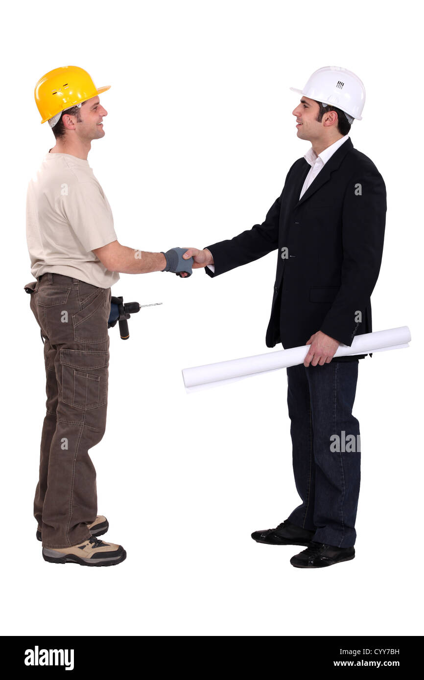 Construction workers greeting each other Stock Photo - Alamy