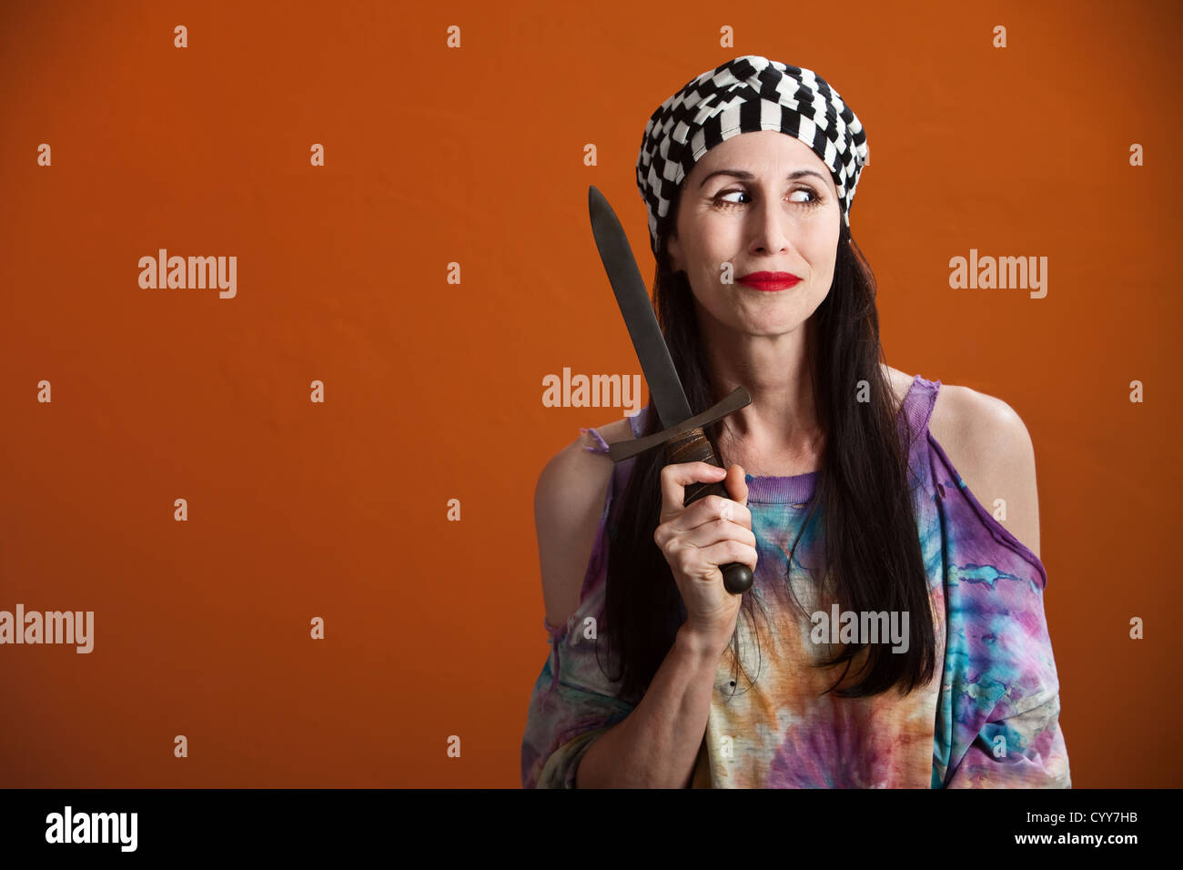 Woman holding dagger hi-res stock photography and images - Alamy