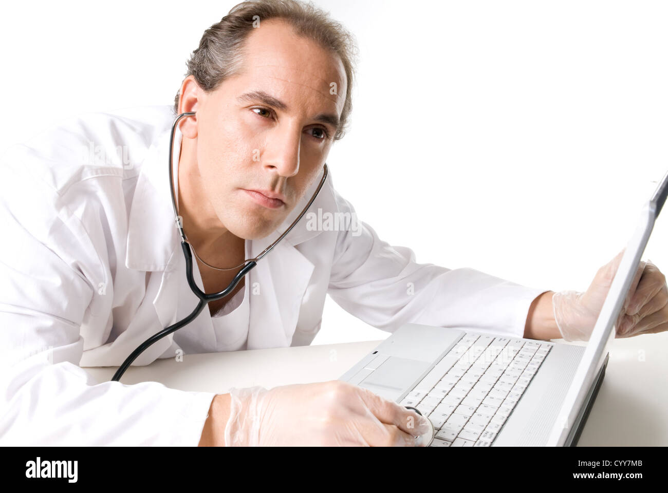 Doctor with stethoscope fixing laptop, good technical support symbol ...