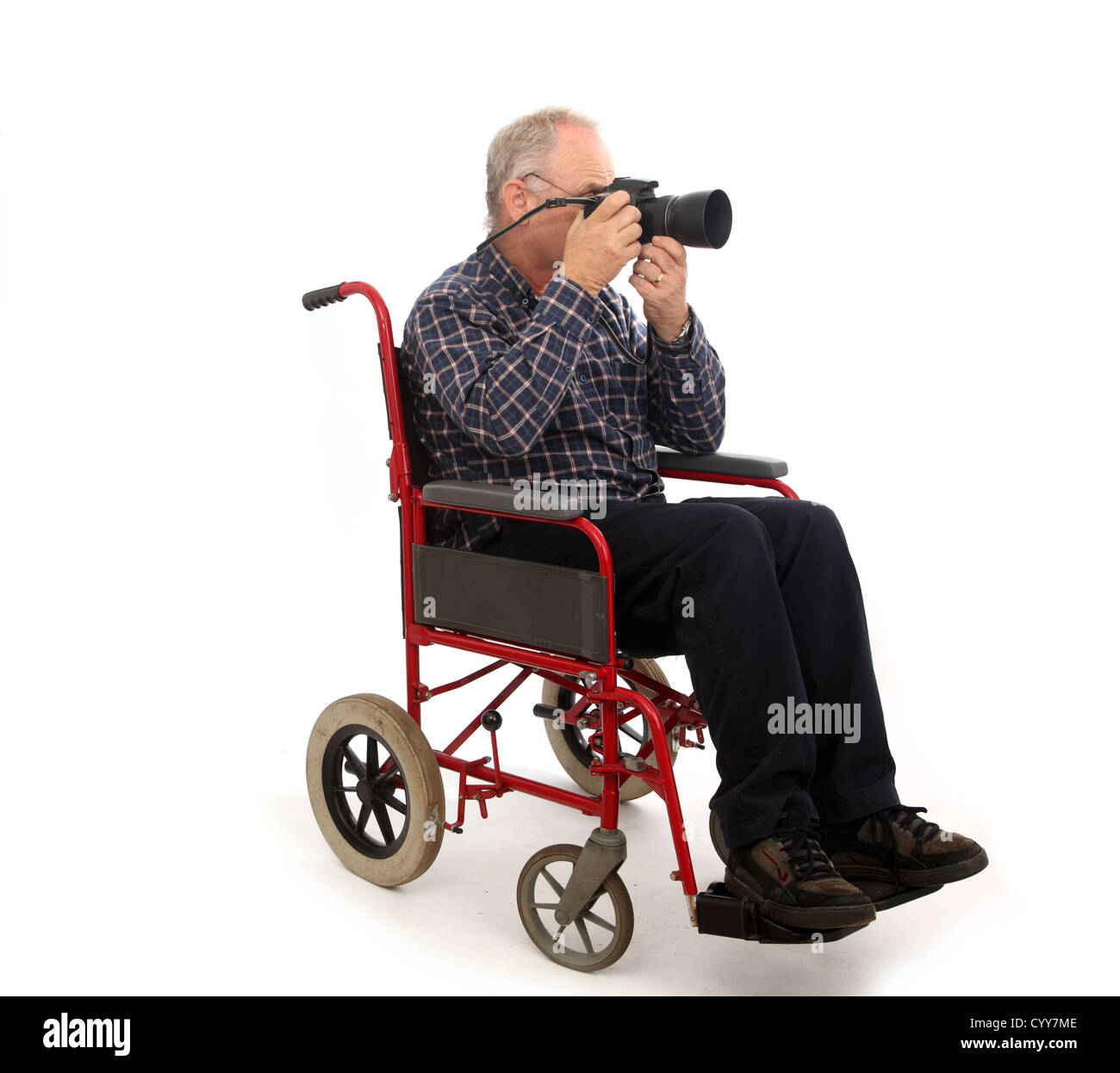 Mature disabled photographer isolated on white, June 2012 Stock Photo ...