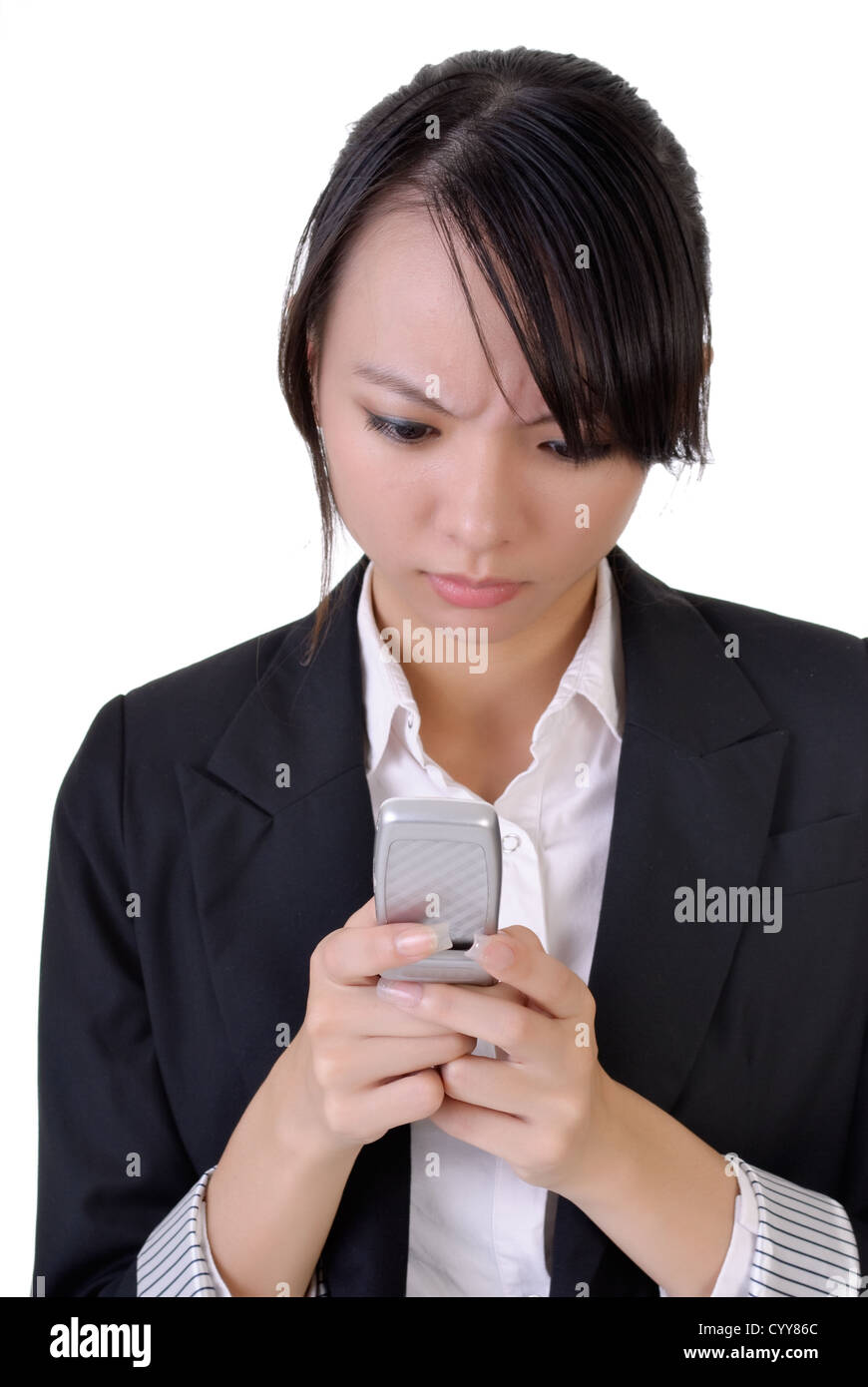 Angry business woman looking SMS on cellphone against white background Stock Photo - Alamy