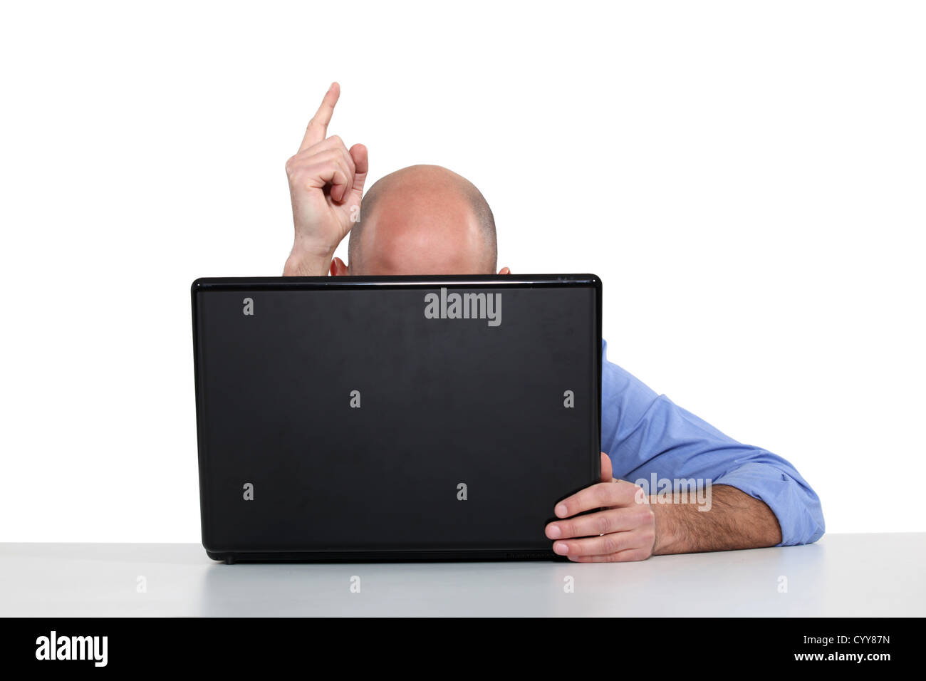 Man with laptop pointing Stock Photo - Alamy