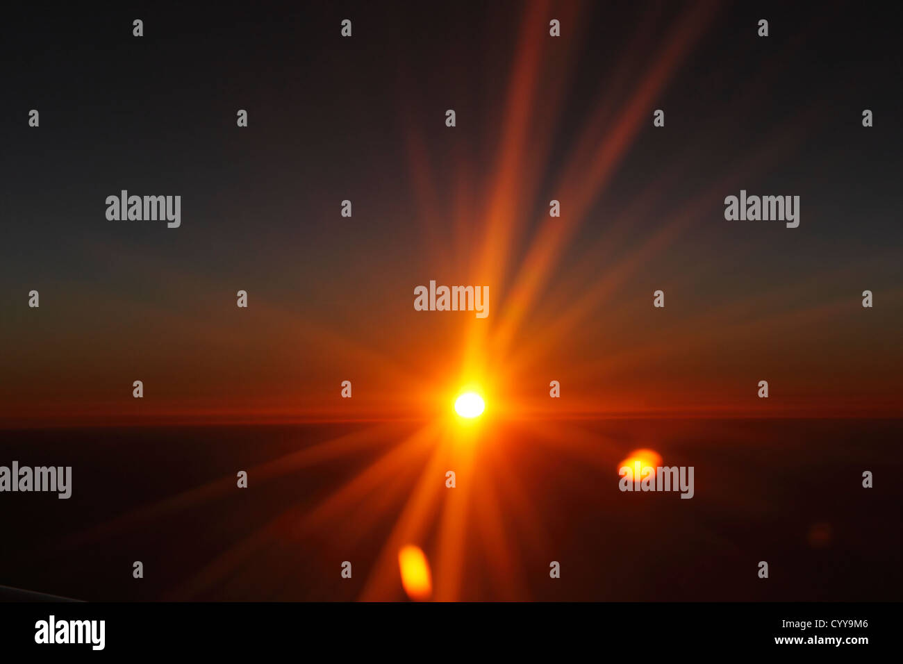 Sunset from the plane window above Israel Stock Photo - Alamy