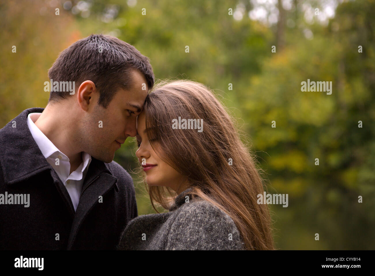 sad young couple in autumn park together Stock Photo - Alamy