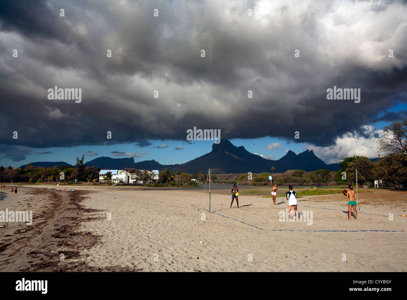 People playing ball game in a public beach, Tamarin, Mauritius island ...