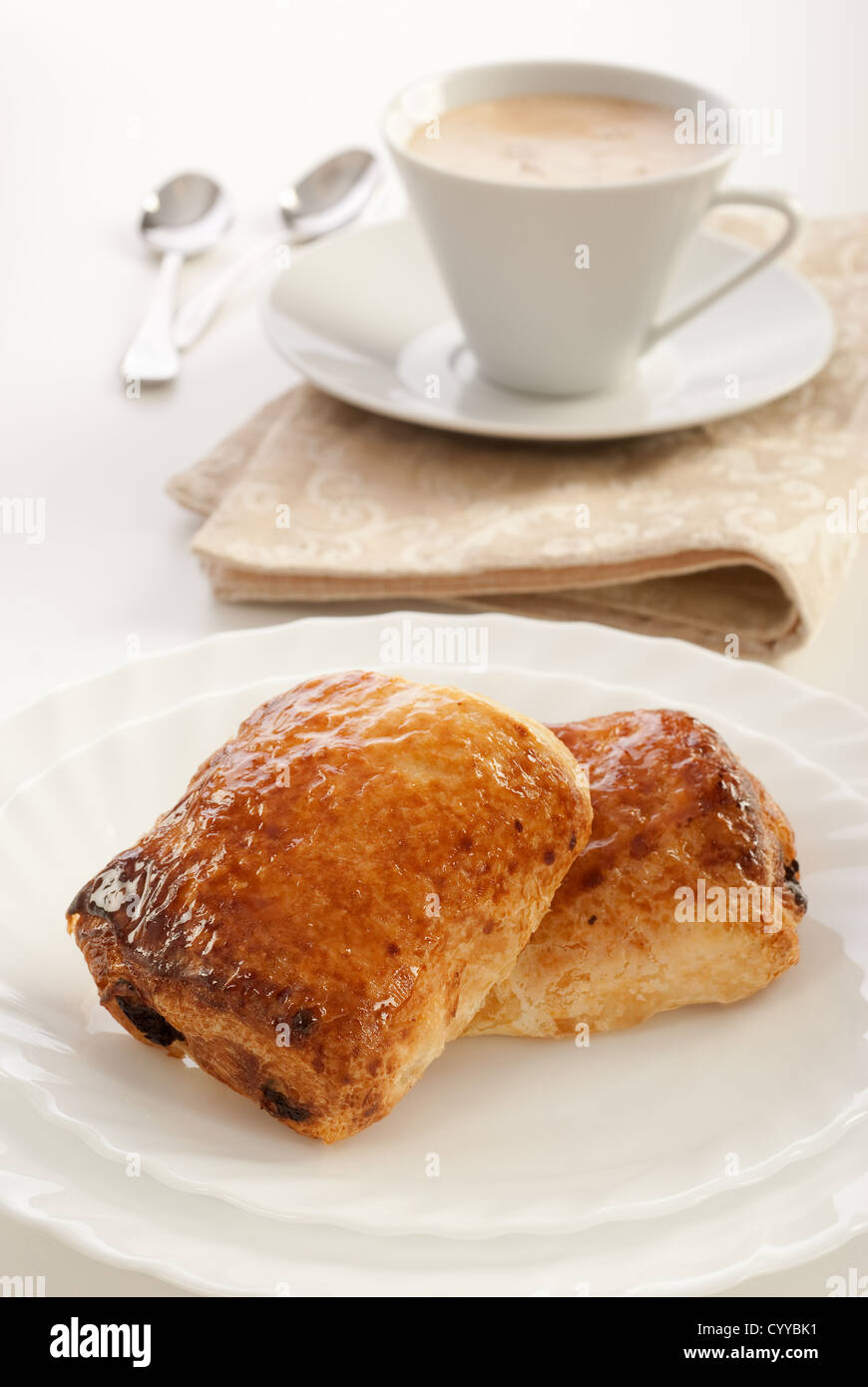 plate of pain au chocolat and cup of cappuccino Stock Photo - Alamy
