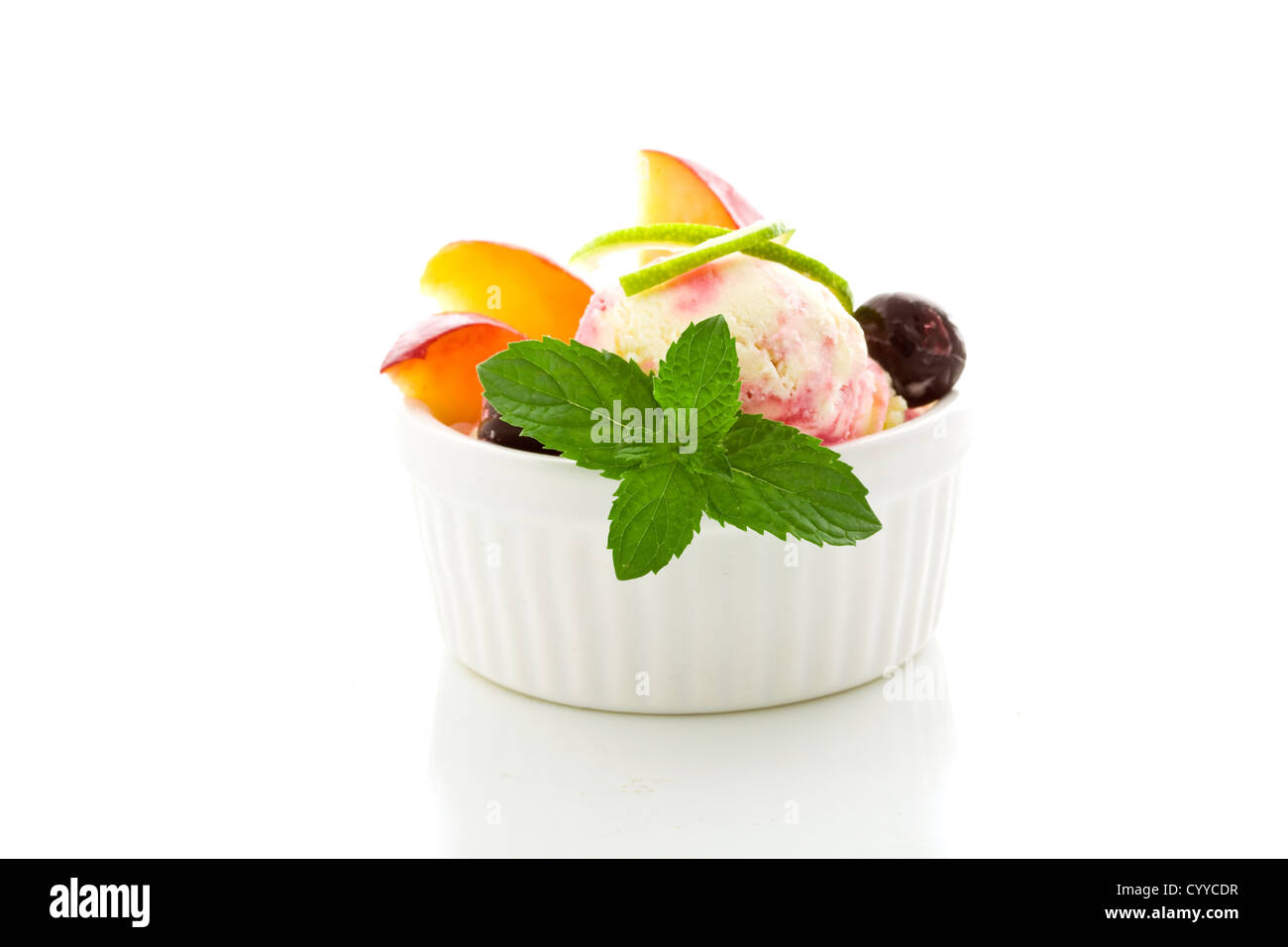photo of Ice cream with fruits on isolated white background Stock Photo ...