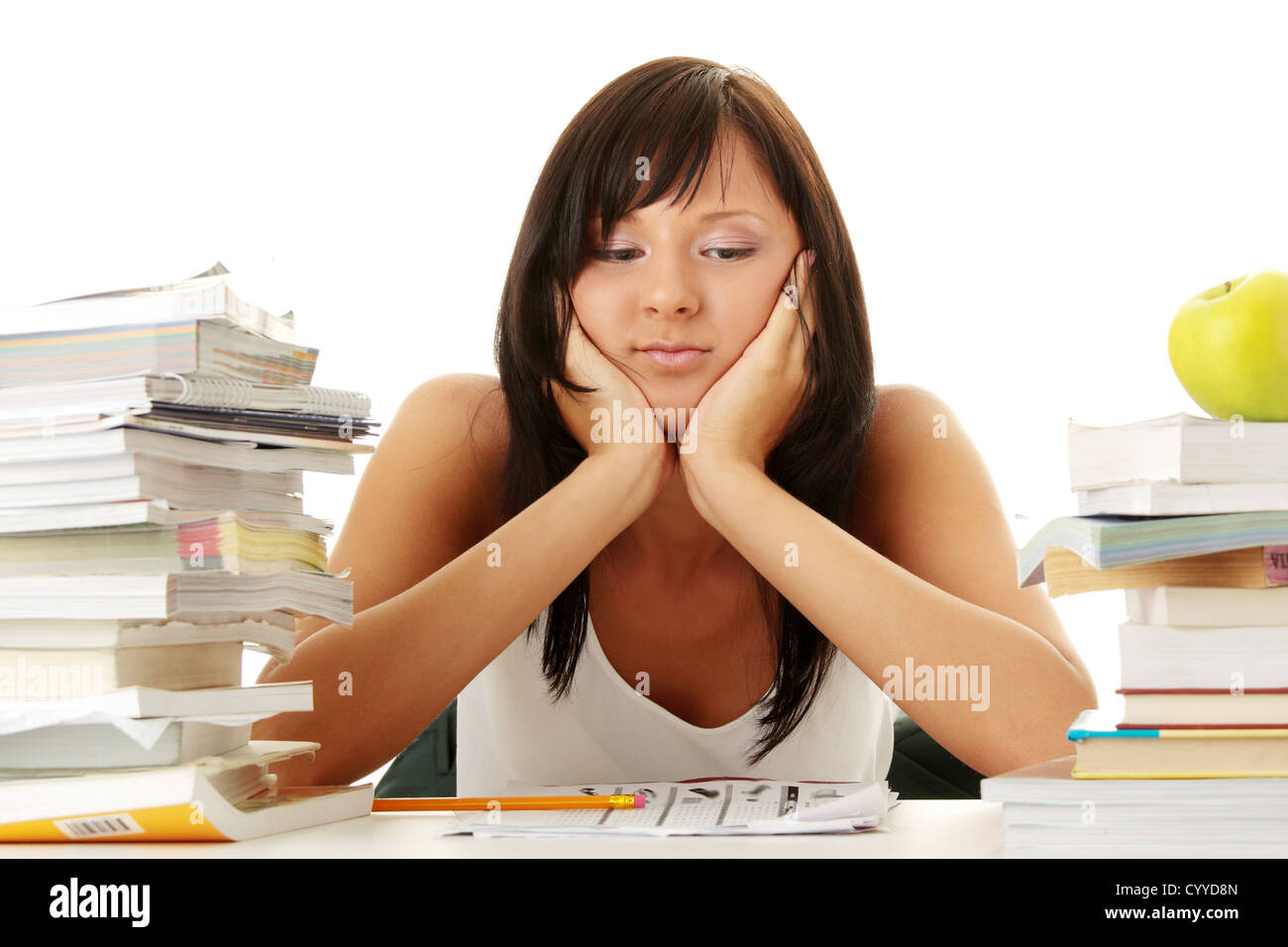 Young woman studying at the desk isolated on white background Stock ...
